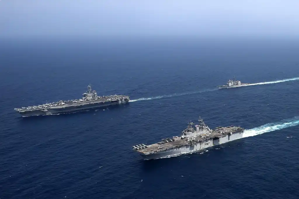 USS Abraham Lincoln Carrier Strike Group Escorted by Nuclear Submarine ...